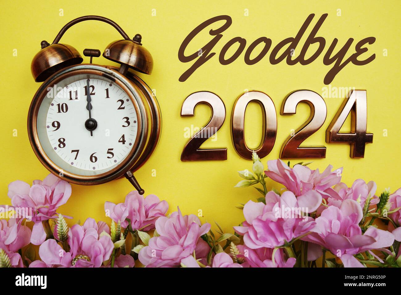 Goodbye 2024 text with alarmclock and flower decoration on yellow ...