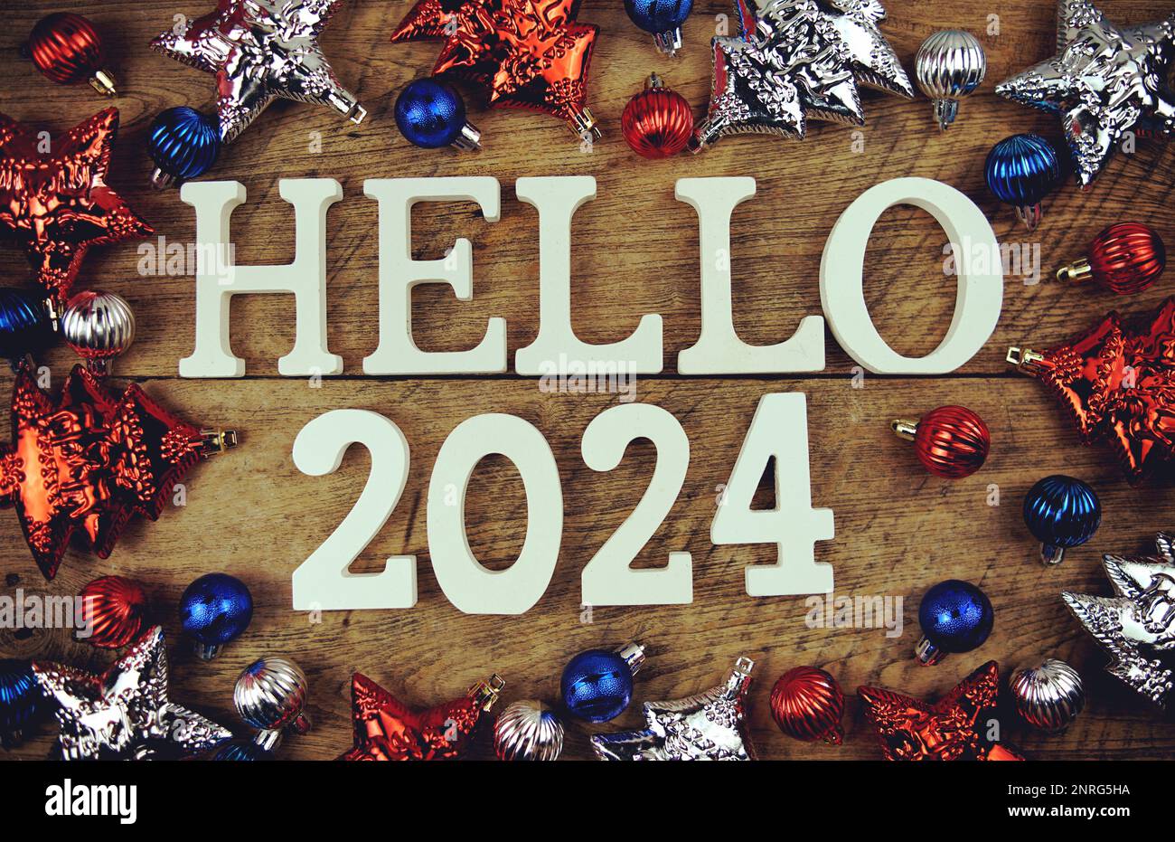 Hello 2024 alphabet letters with christmas decoration on wooden ...