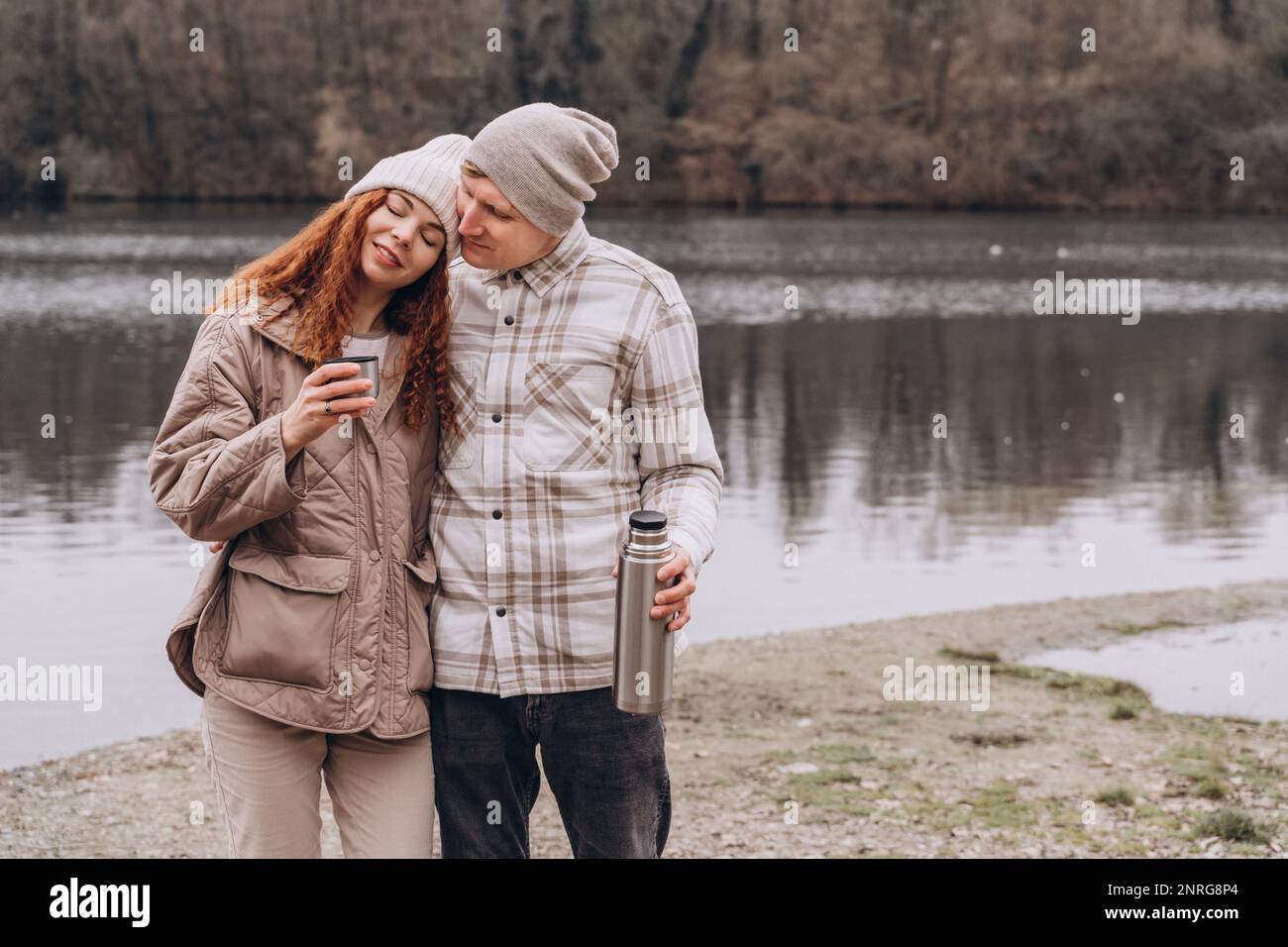 Romantic walk of a couple in a springtime park on the river Stock Photo ...