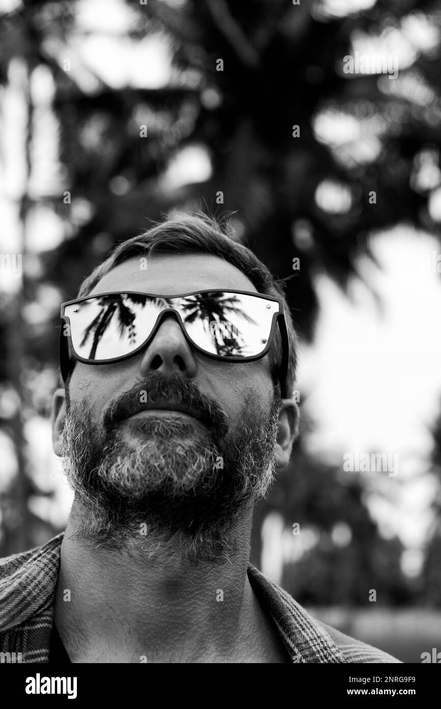 Sunglasses reflection palm tree Black and White Stock Photos & Images ...