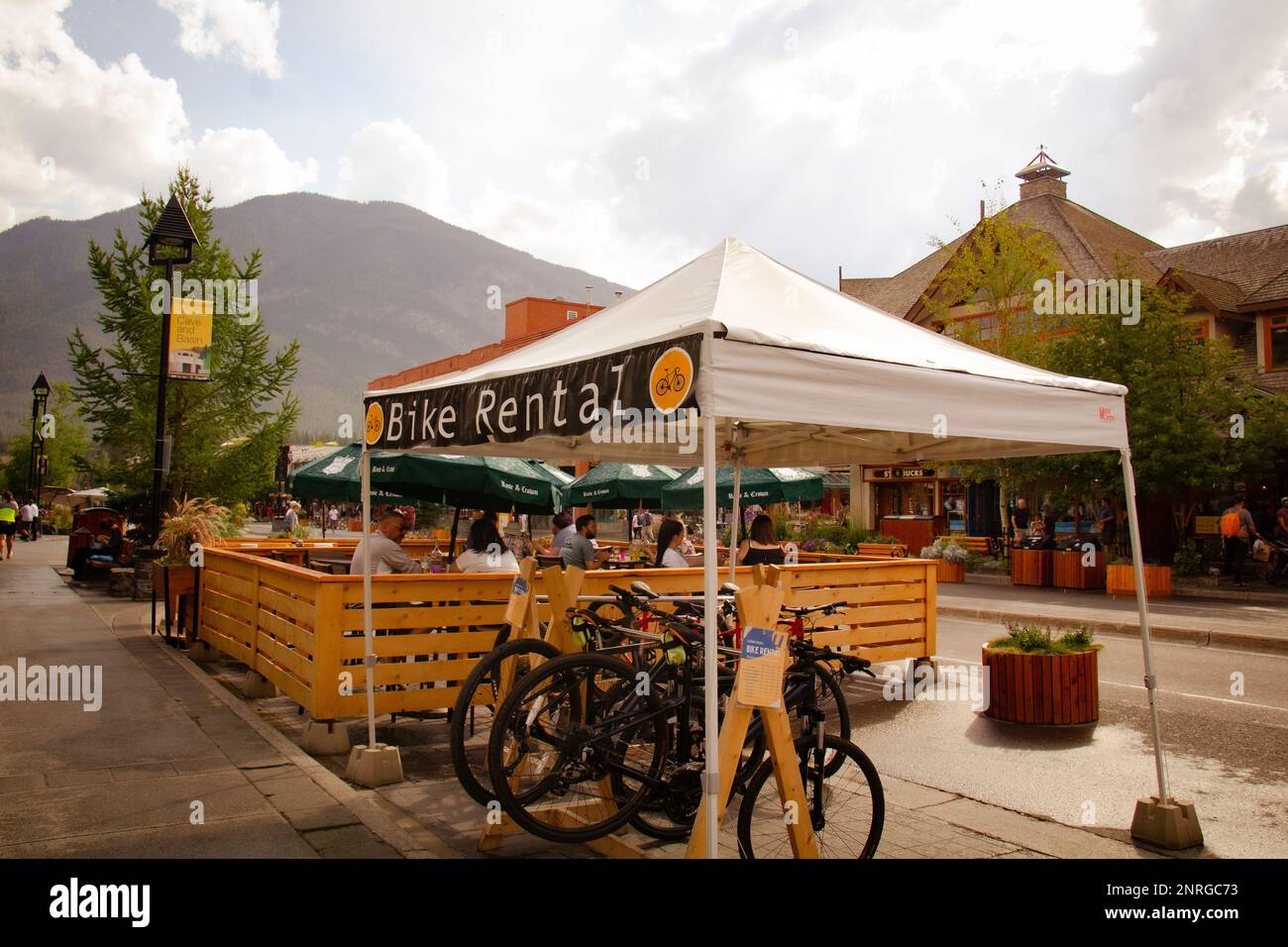 A large group of people congregate outside a bustling restaurant ...