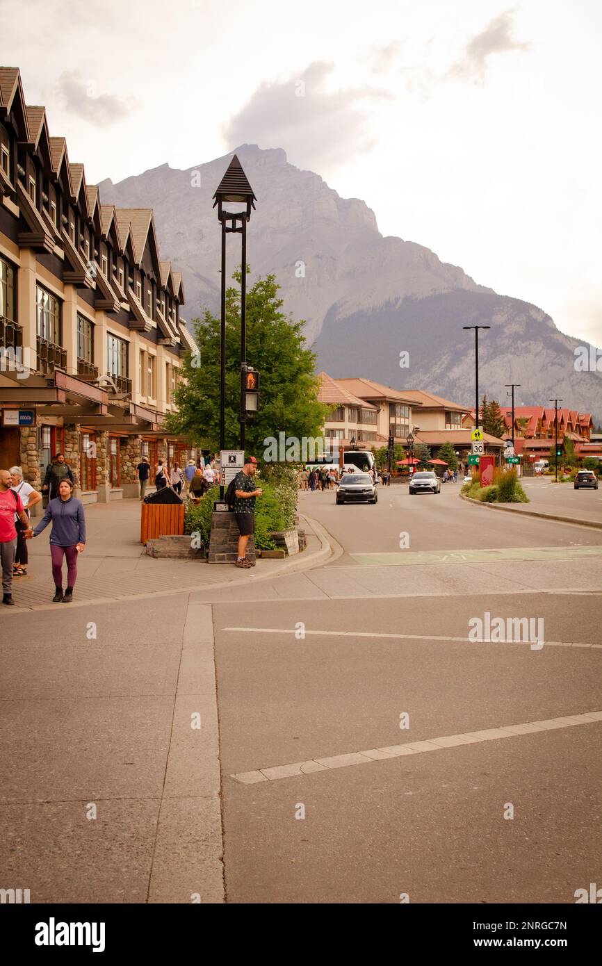 A diverse group of people walking down a bustling city street, Banff ...
