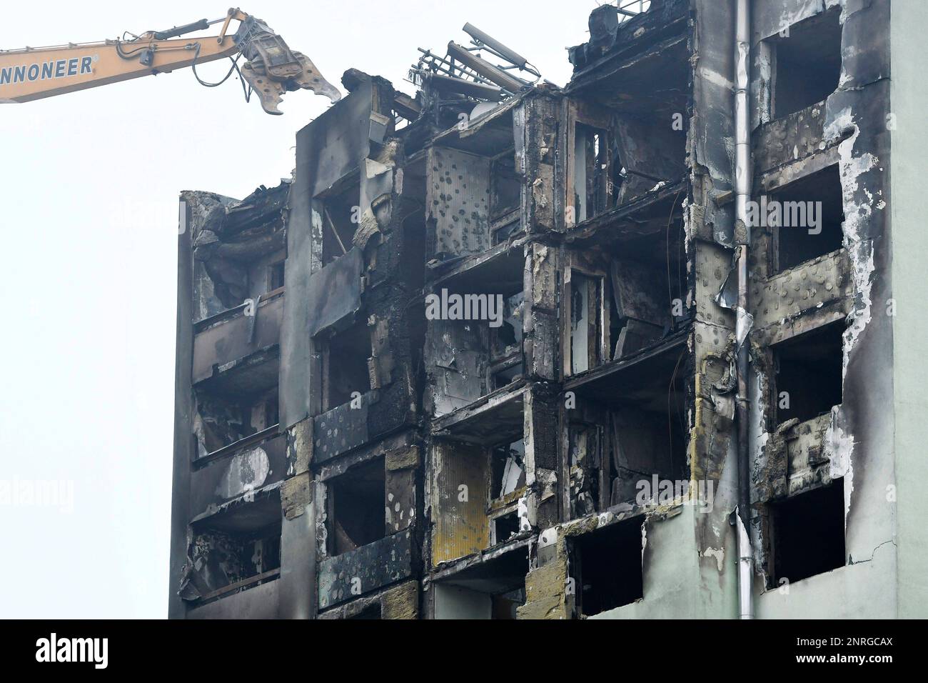 Work begins on demolishing the apartment block that was devastated by a ...