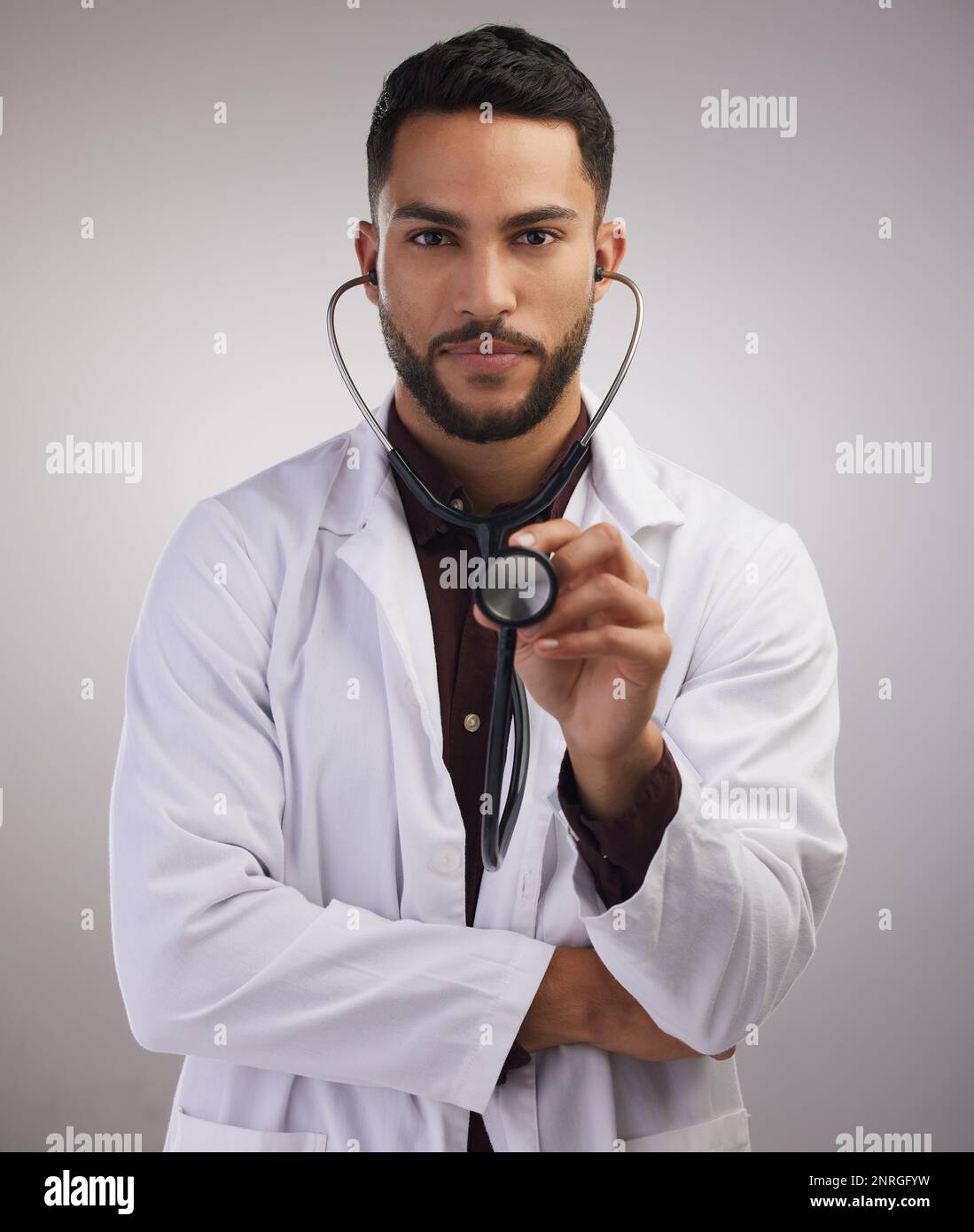 Lets take a listen, shall we. a handsome young doctor standing alone in ...