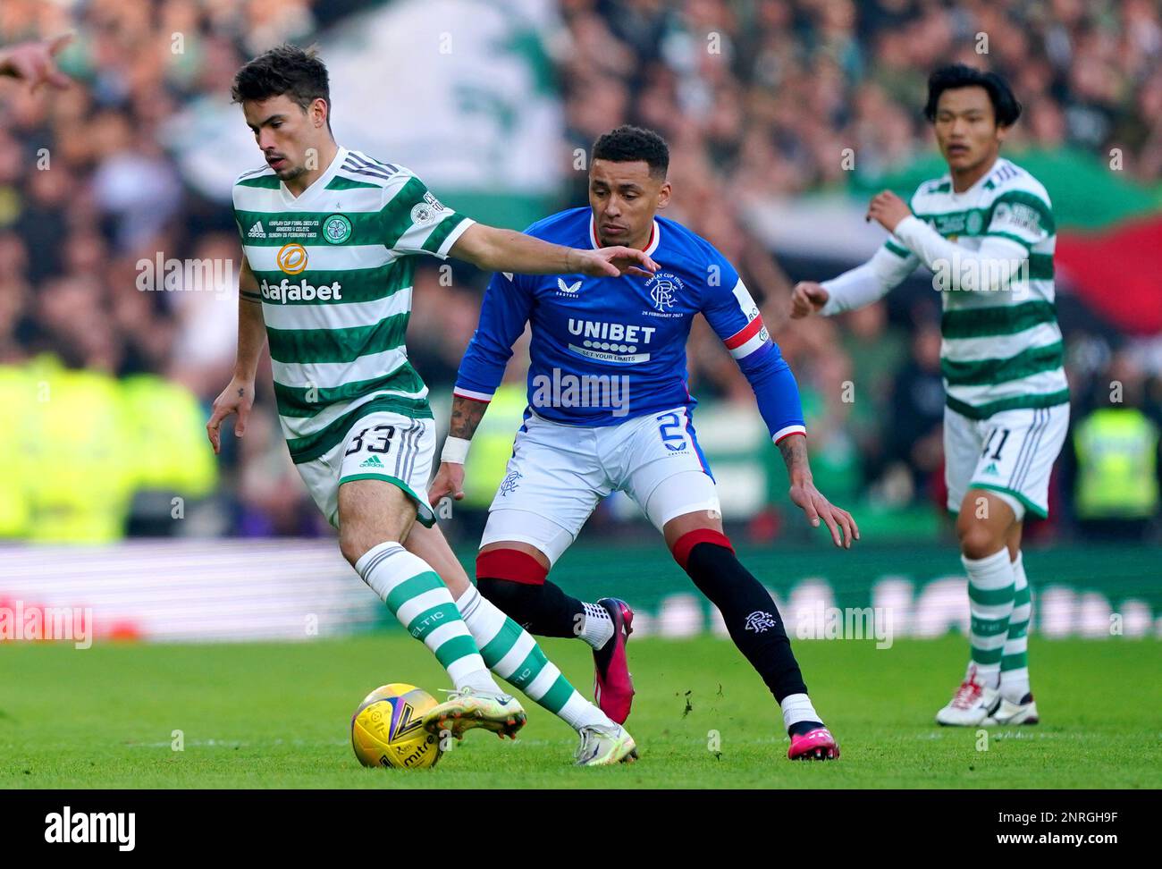 Celtic's Matt O'Riley (left) and Rangers' James Tavernier battle for ...