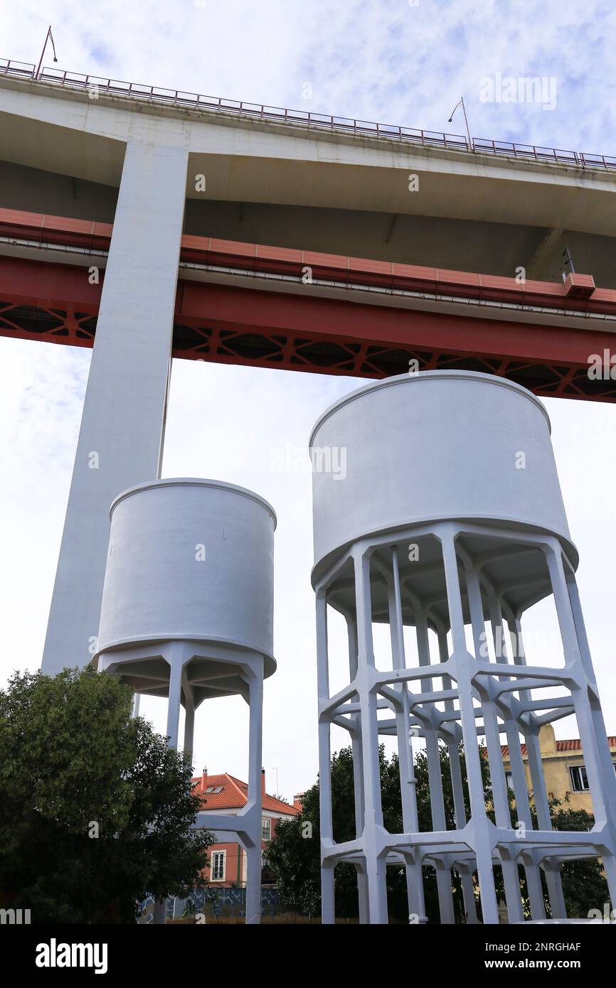 Colossal 25th April bridge structure over white water reservoir in LX ...