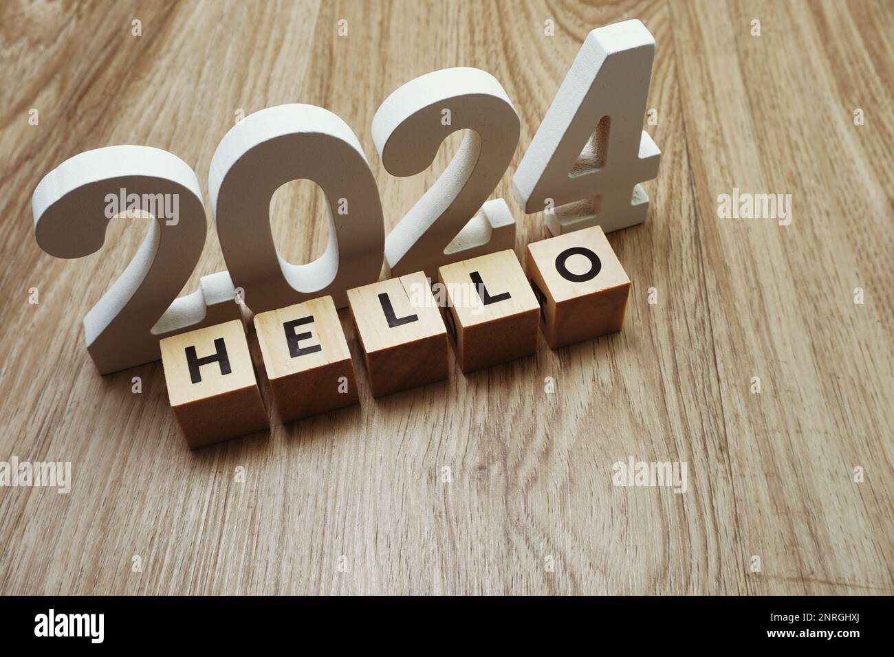 Hello 2024 word alphabet letters on wooden background Stock Photo - Alamy