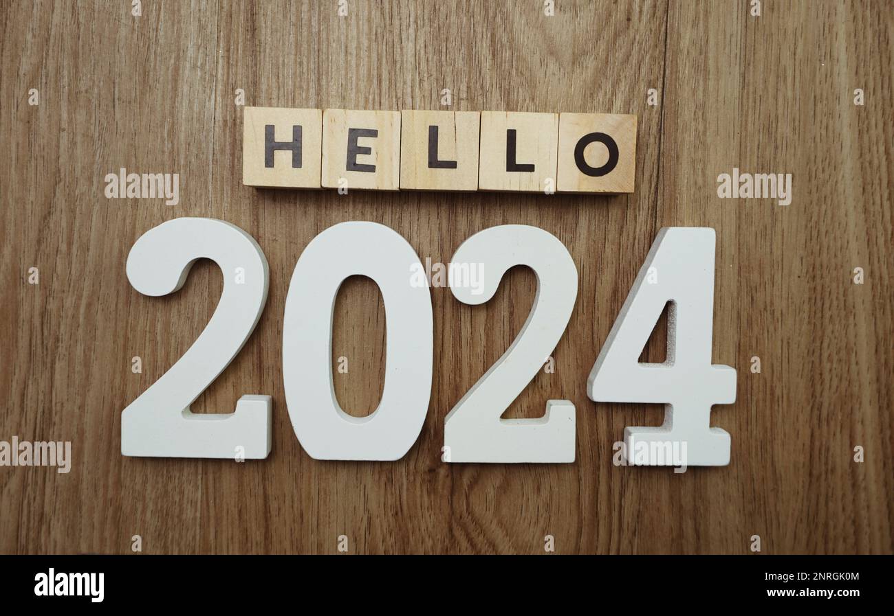 Hello 2024 word alphabet letters on wooden background Stock Photo - Alamy