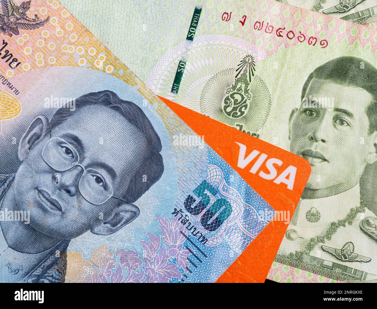 Macro Detail With A 50 Thai Baht Banknote And A Visa Debit Or Credit Card The Baht Is The