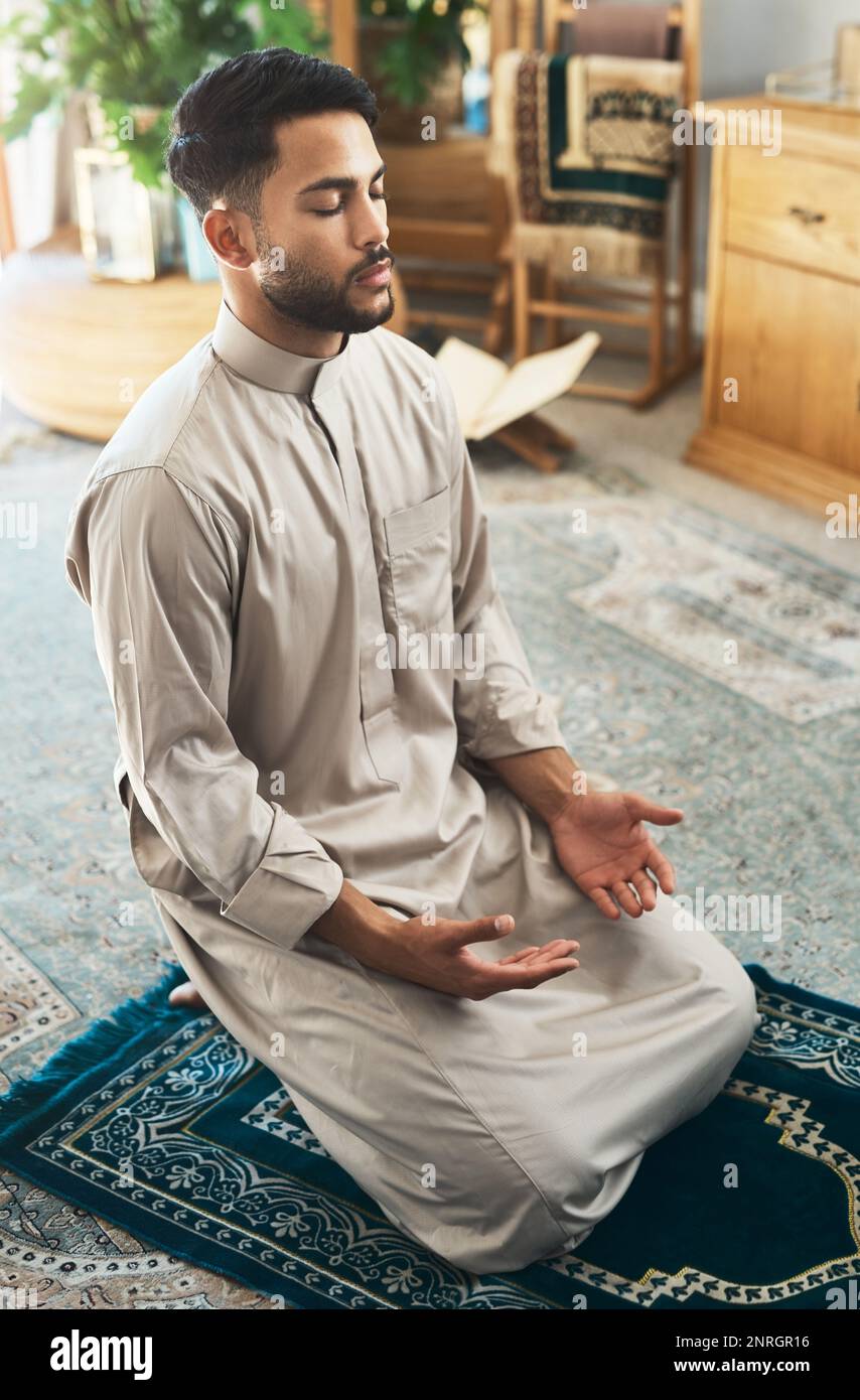 Find yourself a quiet place. a young muslim man praying in the lounge ...