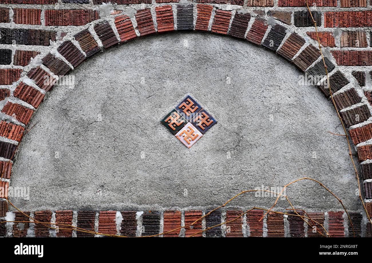 Four tiles with swastika-like designs on the facade of Corbin Hall at ...