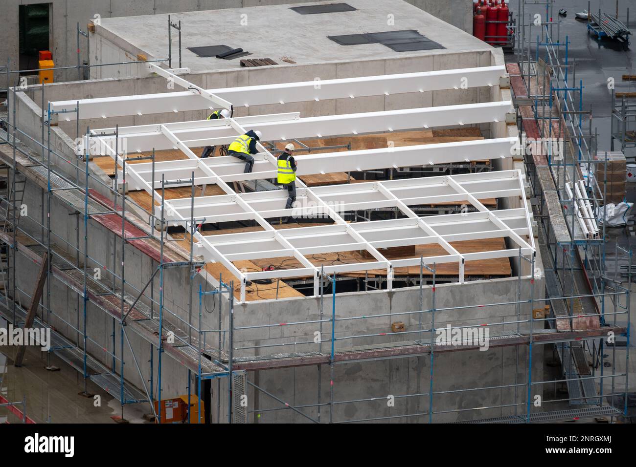Roofer preparing a construction for a light well on the roof of a ...