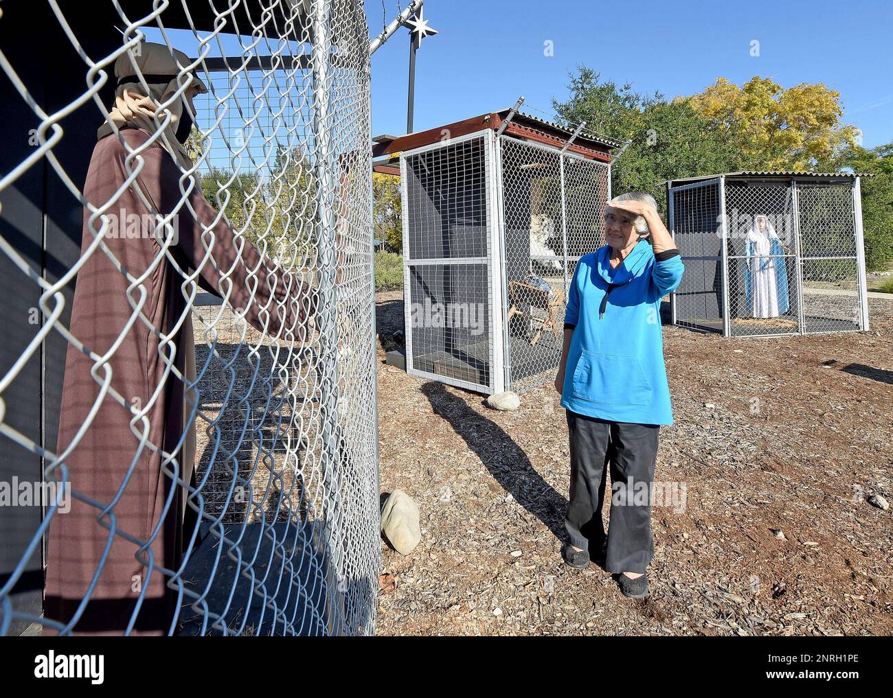 Marie Kelly, from Claremont, looks at a depiction of Joseph in a cage ...