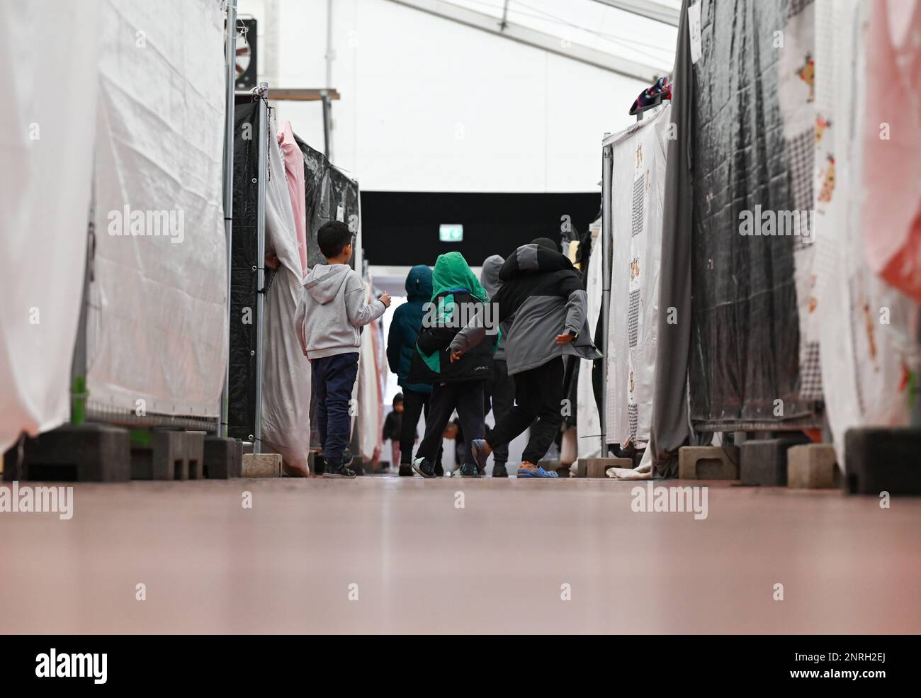 PRODUCTION - 10 February 2023, Hesse, Bensheim: Refugee children run ...