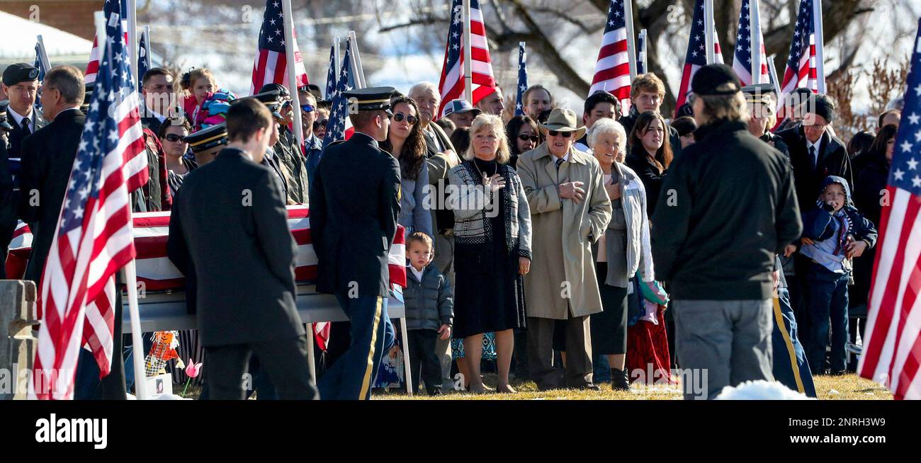 The flag-draped casket of CW2 Kirk T. Fuchigami Jr. arrives at Brigham ...