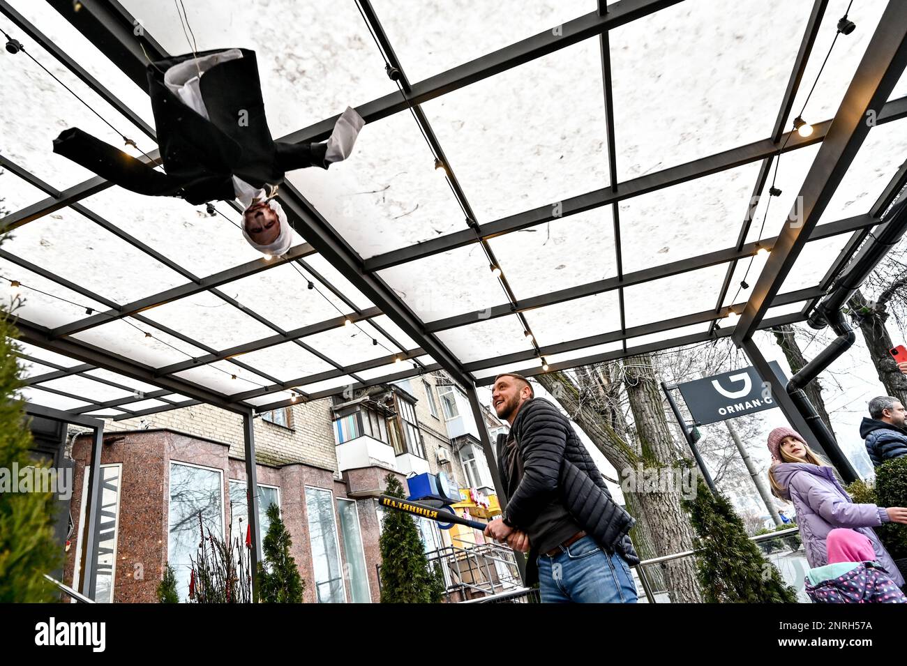 ZAPORIZHZHIA, UKRAINE - FEBRUARY 26, 2023 - A man hits an effigy of ...