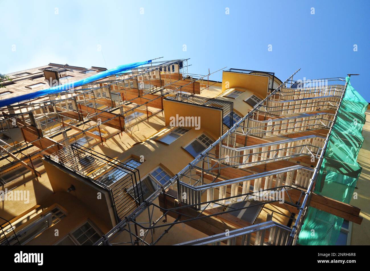 construction of balconies on an old building Stock Photo - Alamy