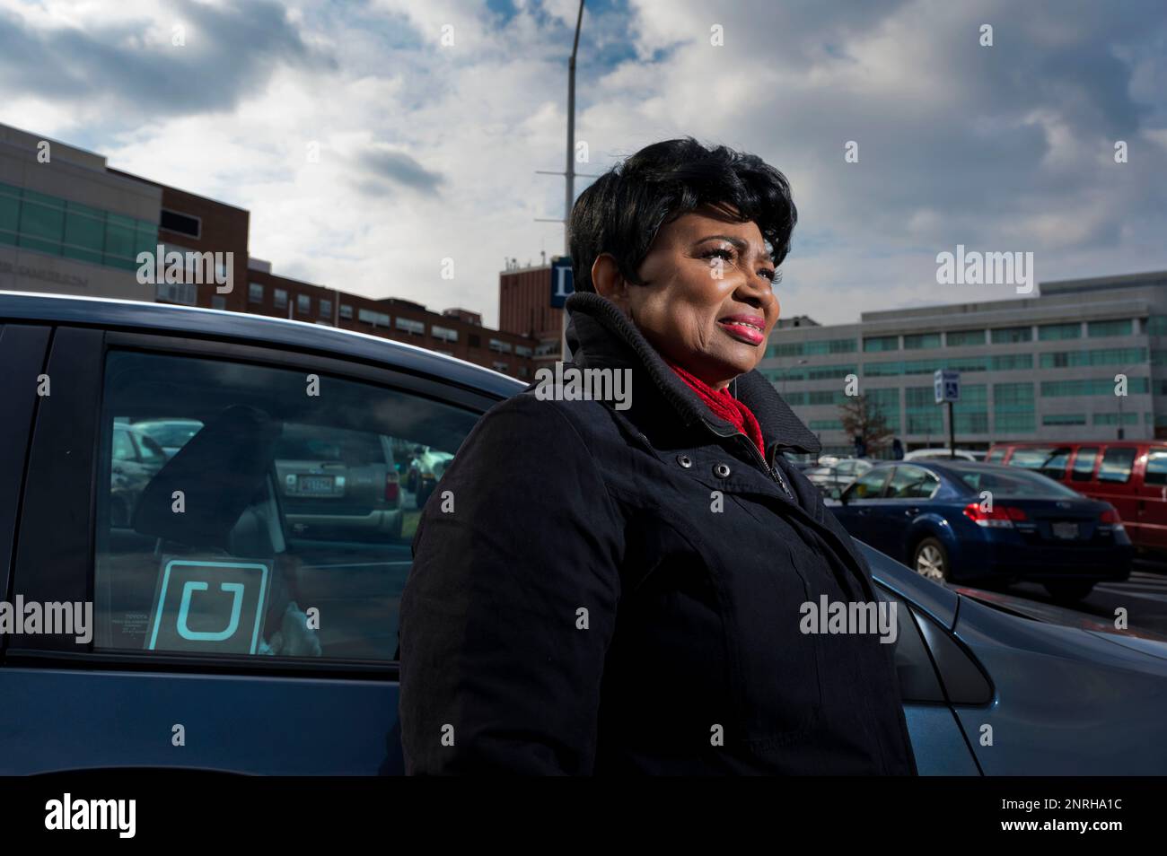 DeBorah Dent poses with her car outside Sinai Hospital, which she uses ...