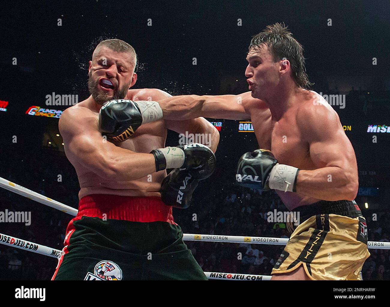 Simon Kean, right, hits Siarhei Liakhovich in a WBC heavyweight boxing ...