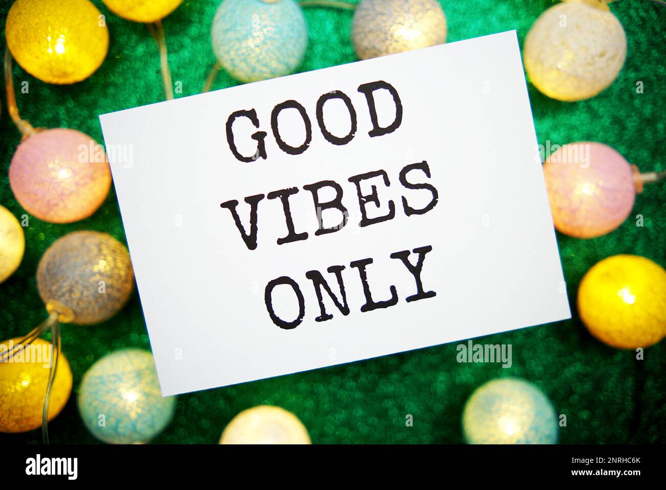 Good Vibes Only text on paper card with LED cotton balls decoration on ...