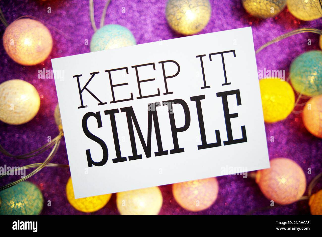 Keep It Simple text on paper card with LED cotton balls decoration on ...
