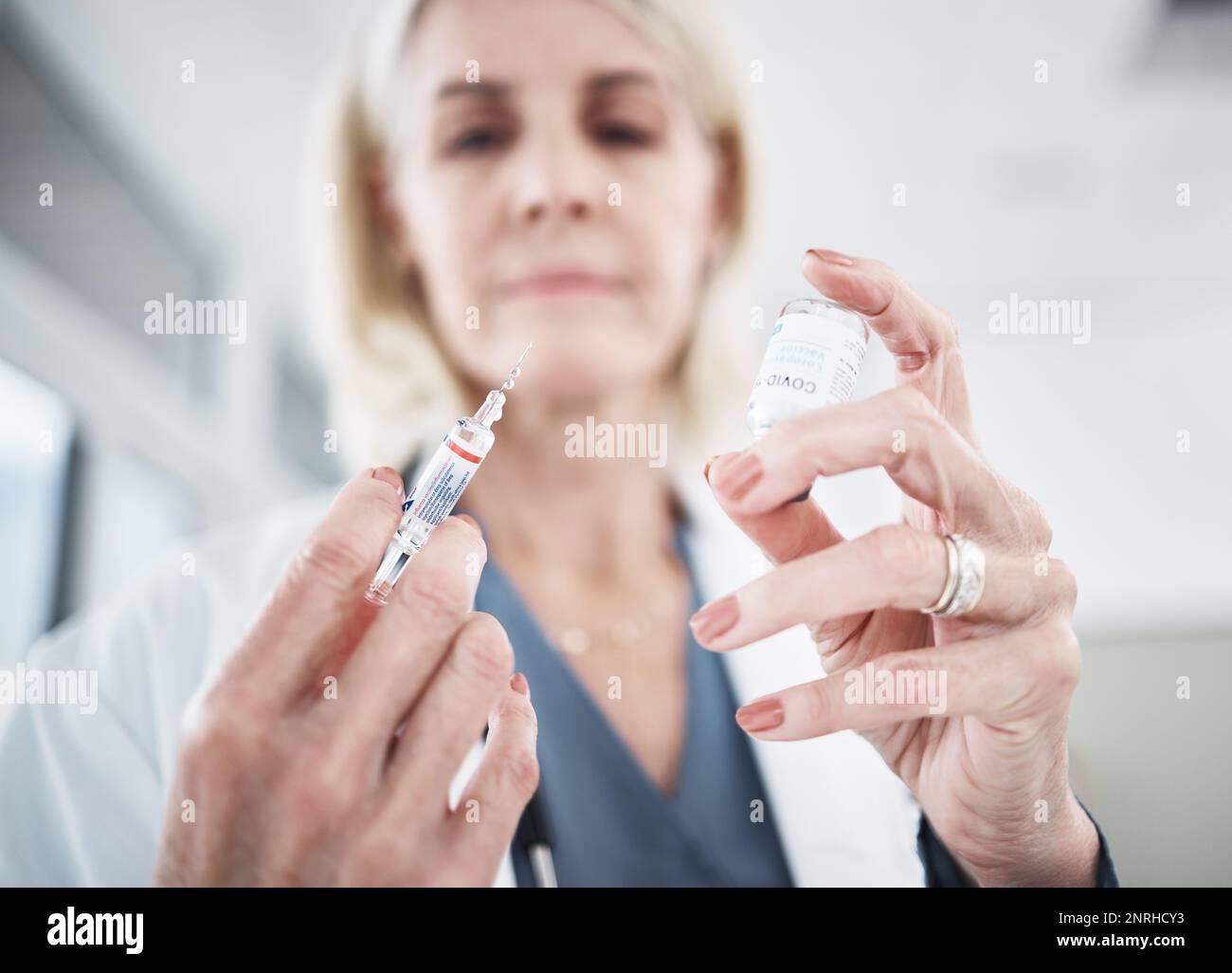 Weve got a virus to wipe out. a doctor getting ready to administer an ...