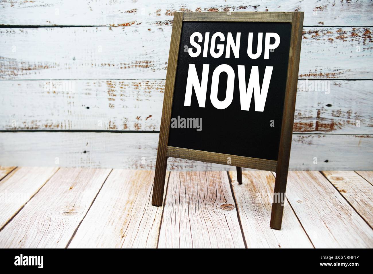 Sign Up Now word sign on wooden background Stock Photo - Alamy