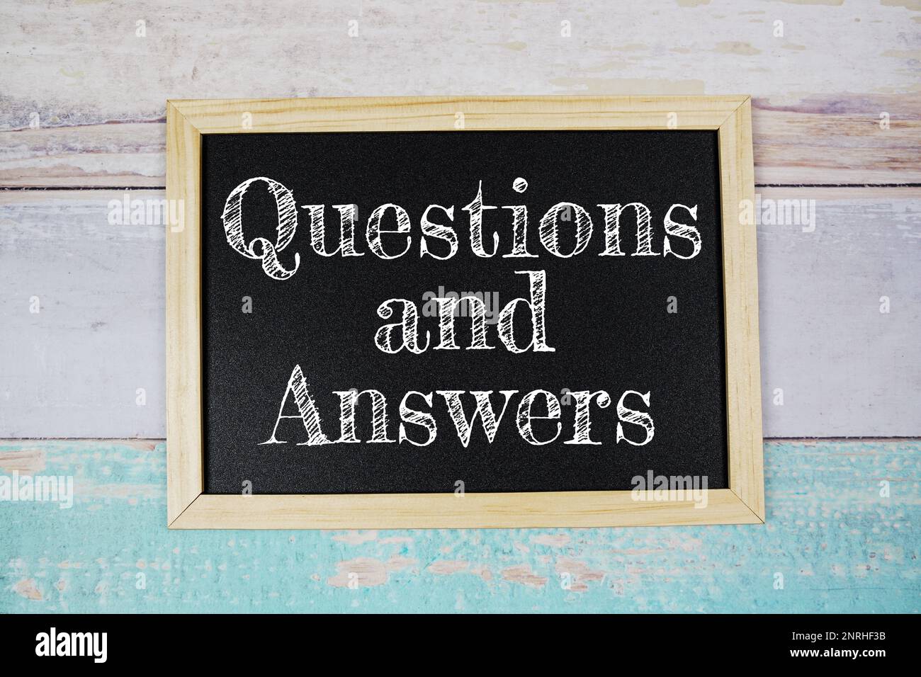 Questions and Answers word on blackboard on wooden background Stock ...