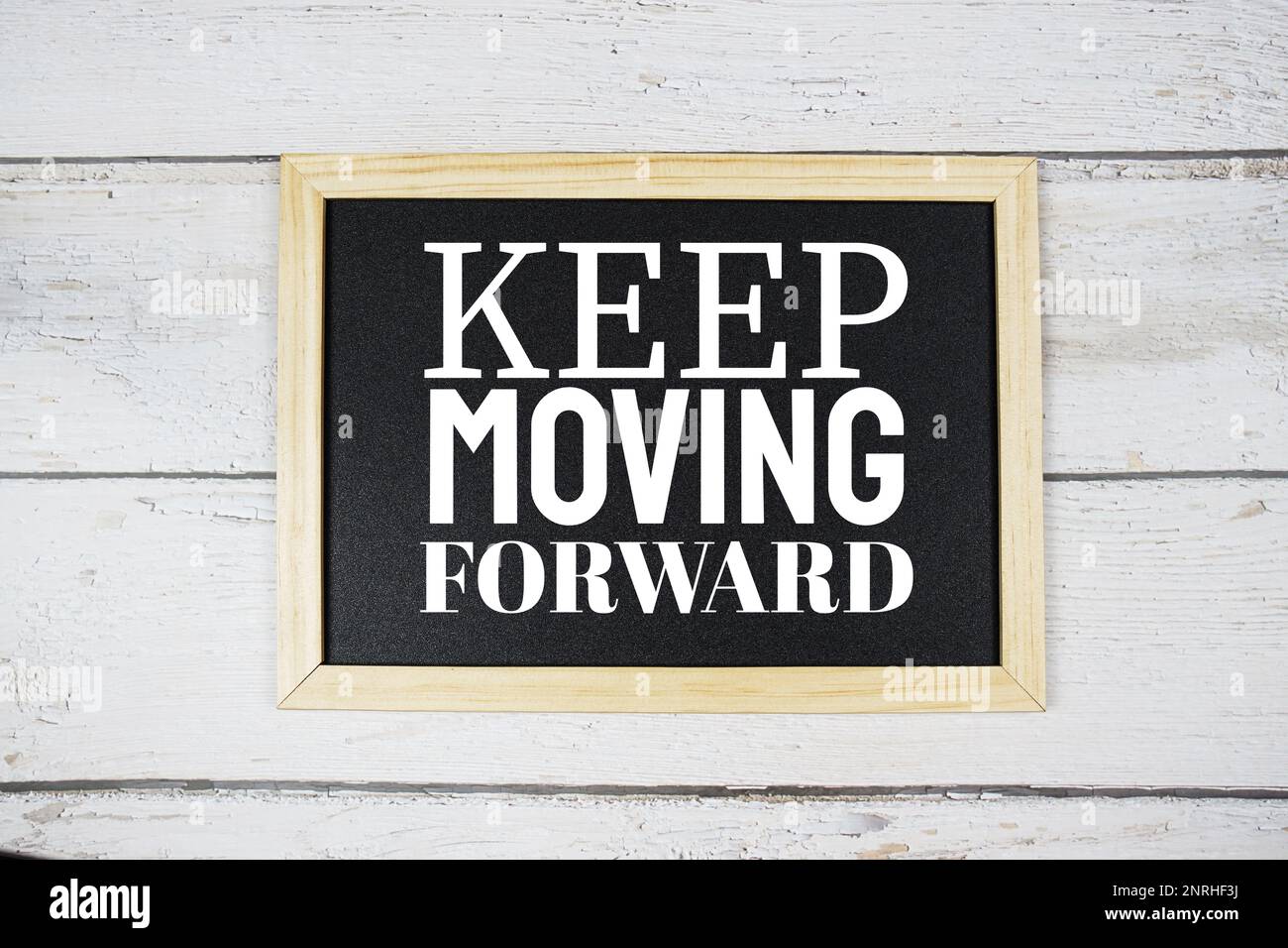 Keep Moving Forward word on blackboard on wooden background Stock Photo ...
