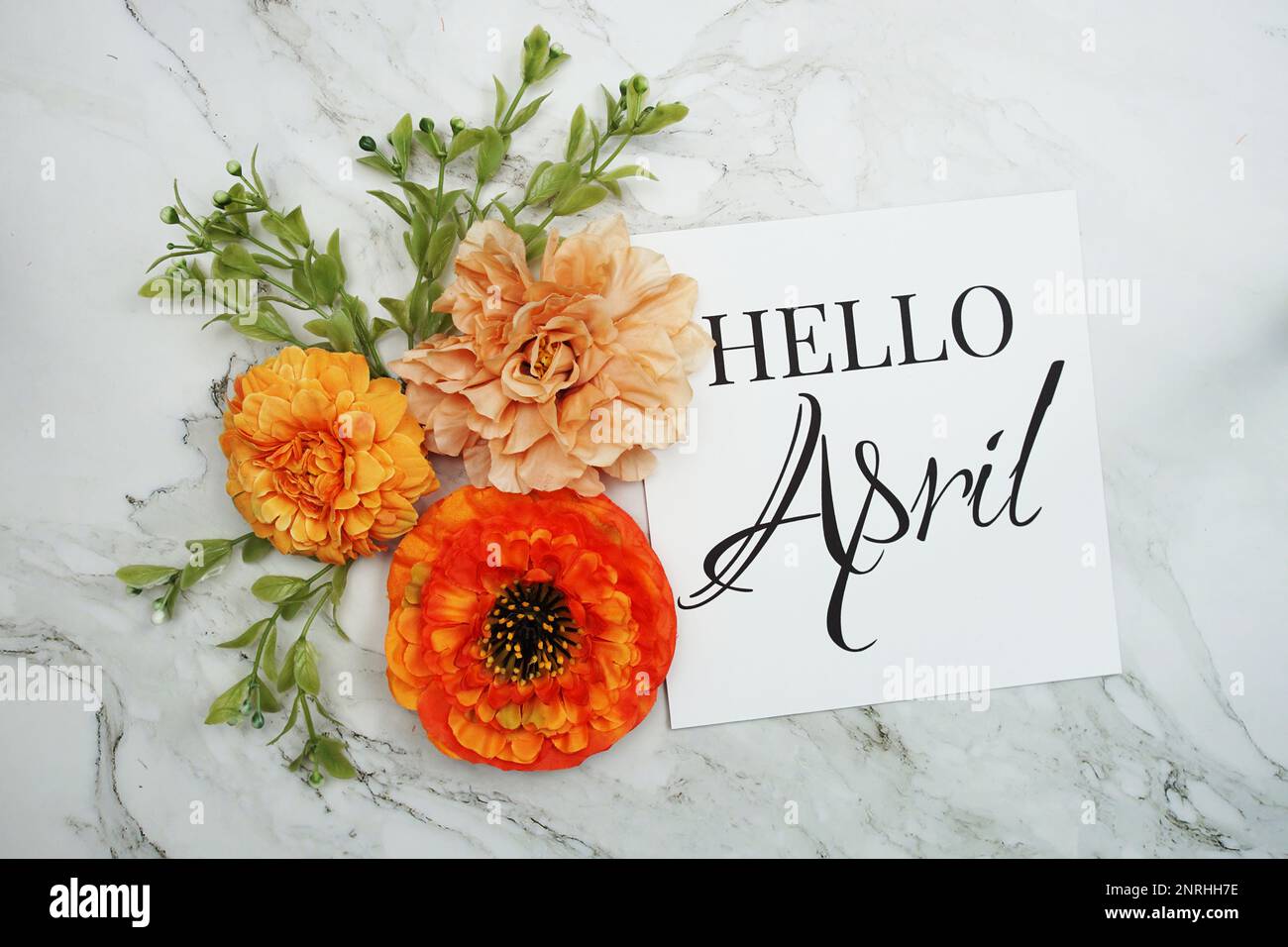 Hello April text with orange flower bouquet on marble background Stock ...