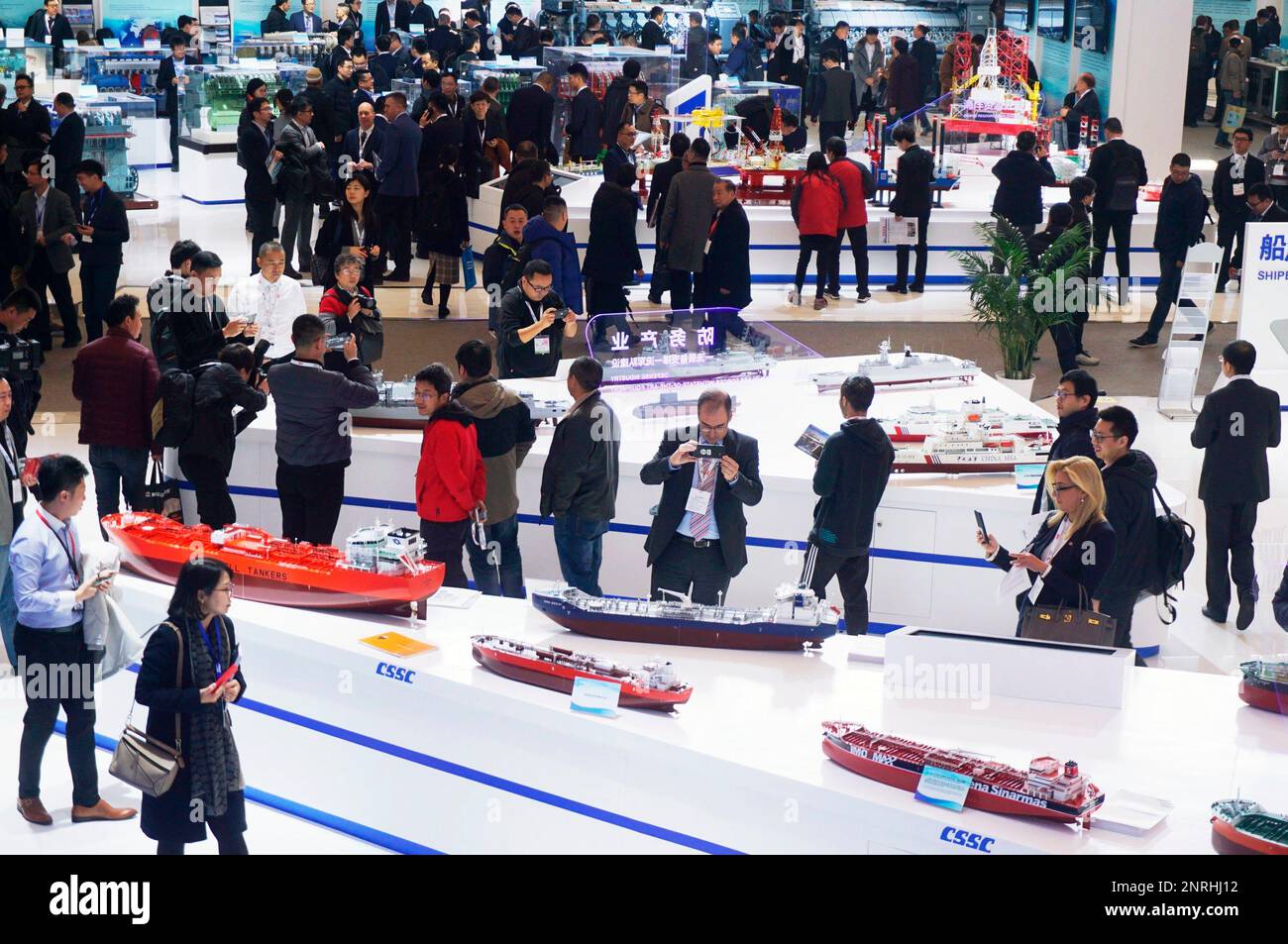 Visitors check out the models of ships exhibited by the China State ...