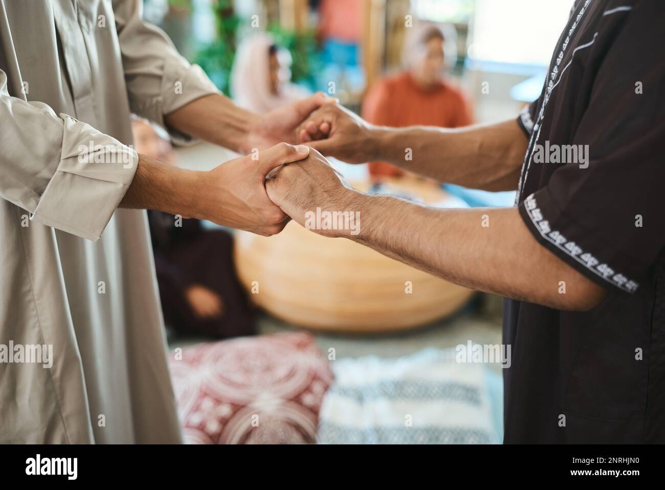 Muslim men holding hands hi-res stock photography and images - Alamy