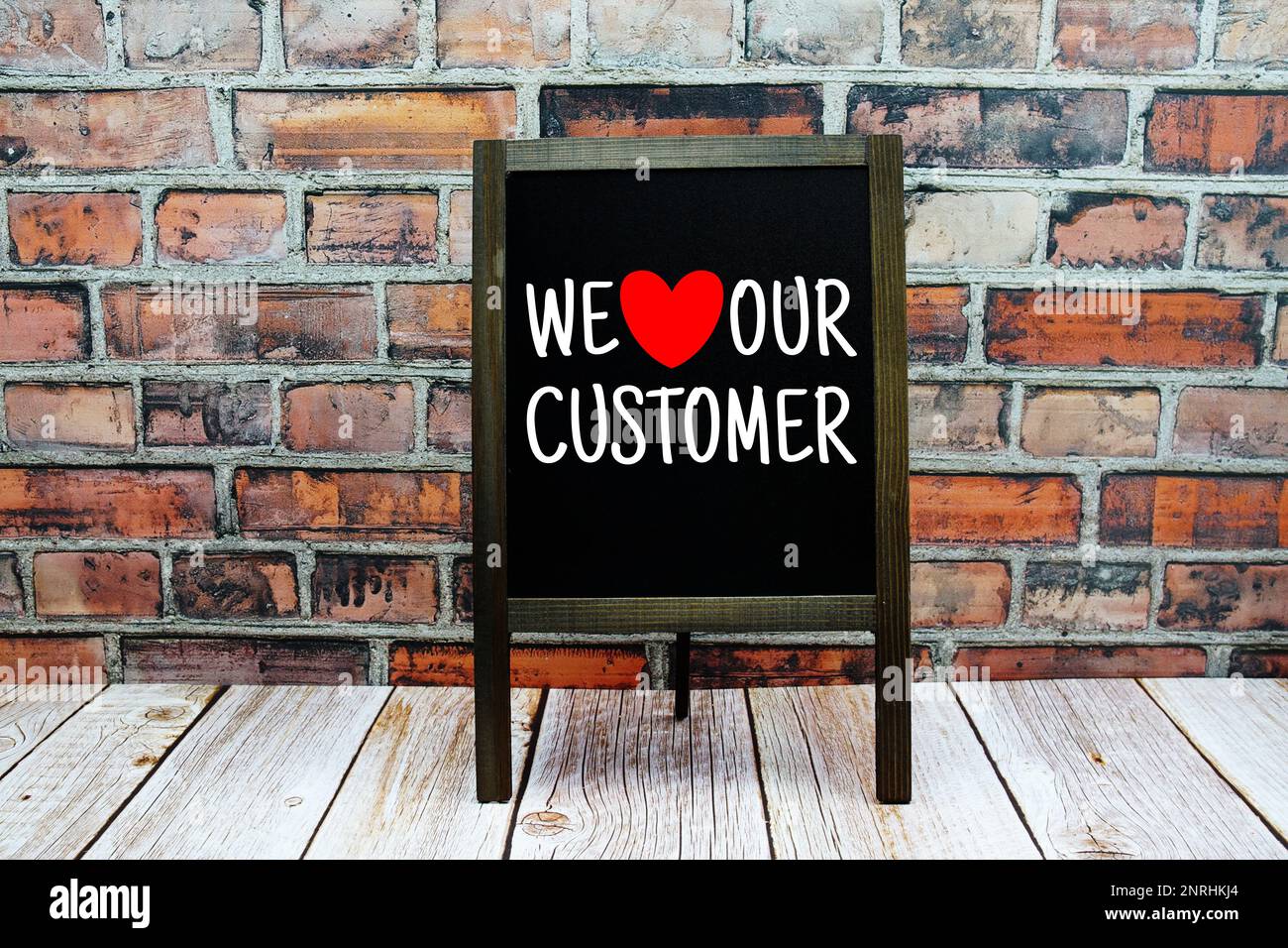 We Love Our Customer typography text on easel blackboard Stock Photo ...