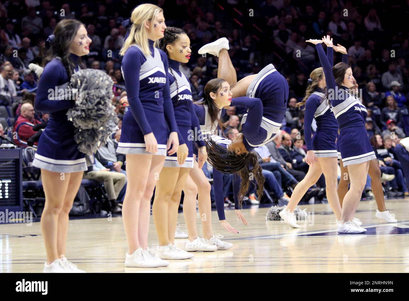 Xavier University cheerleaders perform during an NCAA college ...
