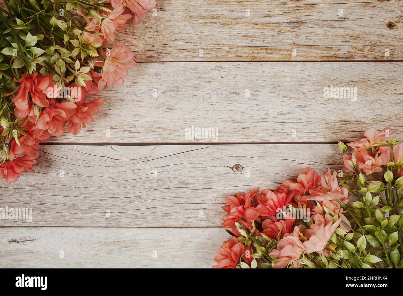 Flower frame with space for copy on wooden background Stock Photo - Alamy