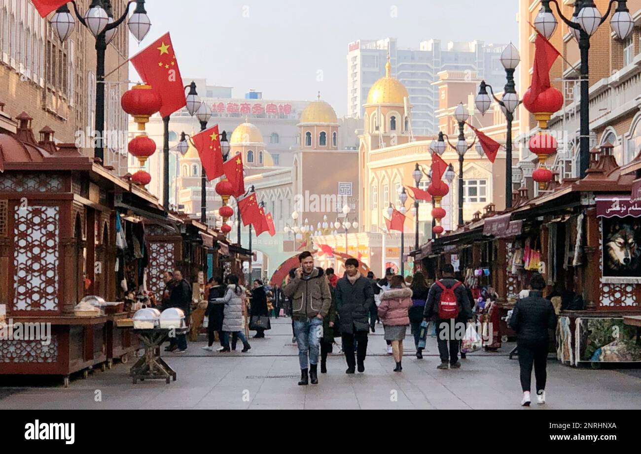 National flags are displayed at a bazar in Urumqi, the capital of the Xinjiang Uygur Autonomous ...