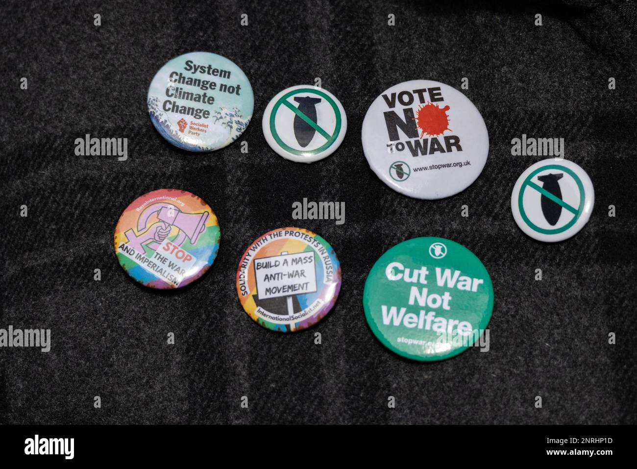 Stop The War and anti-war badges on a protesters jacket, London ...