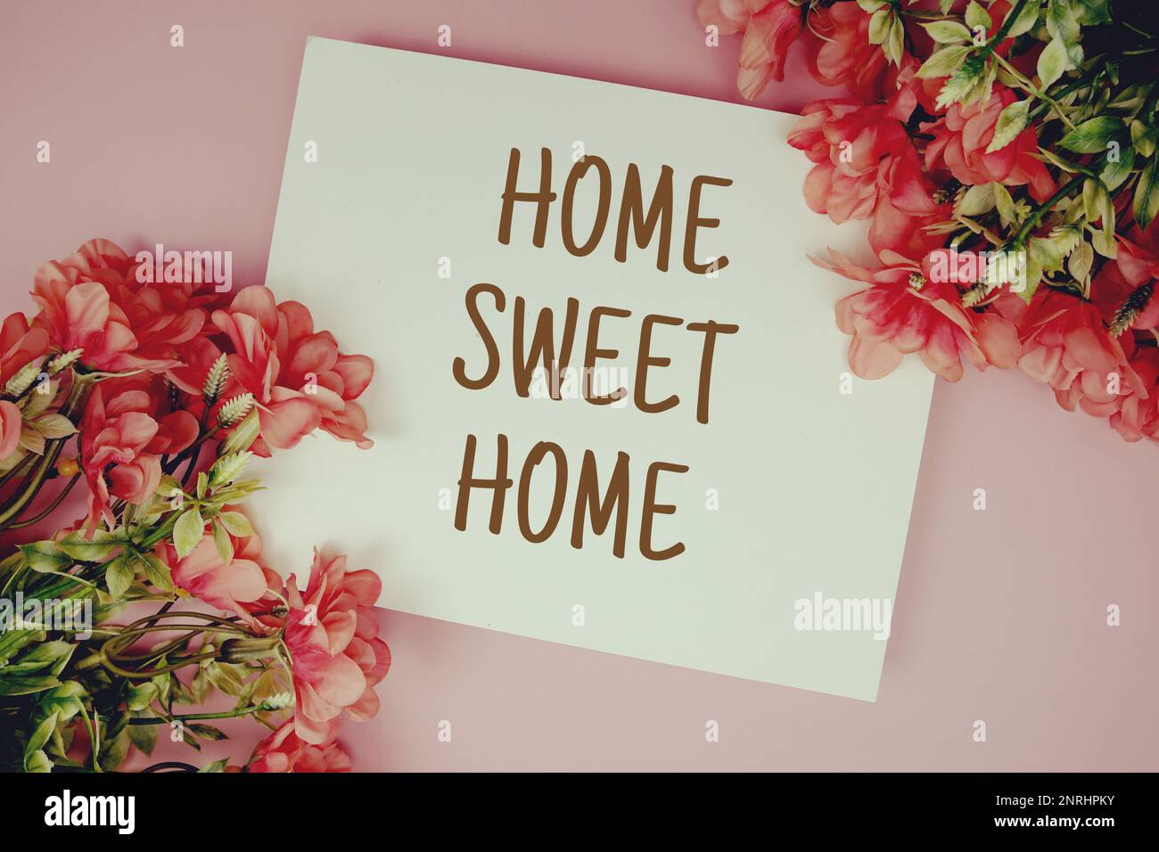Home Sweet Home typography text with flowers on pink background Stock ...