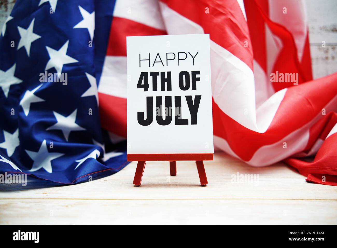 Happy 4th of July text with usa flag on wooden background Stock Photo ...