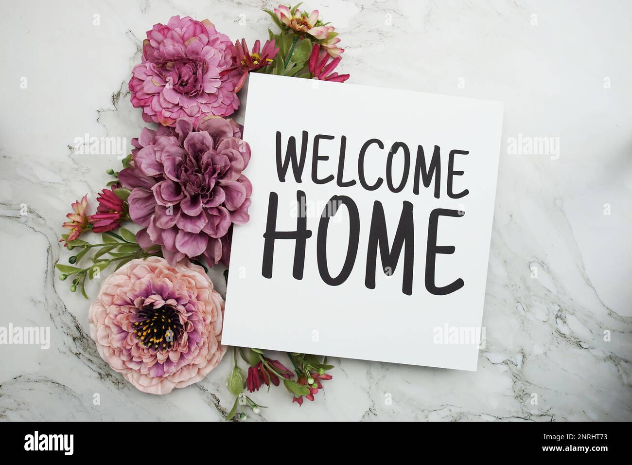 Welcome Home text with pink flower bouquet on marble background Stock ...