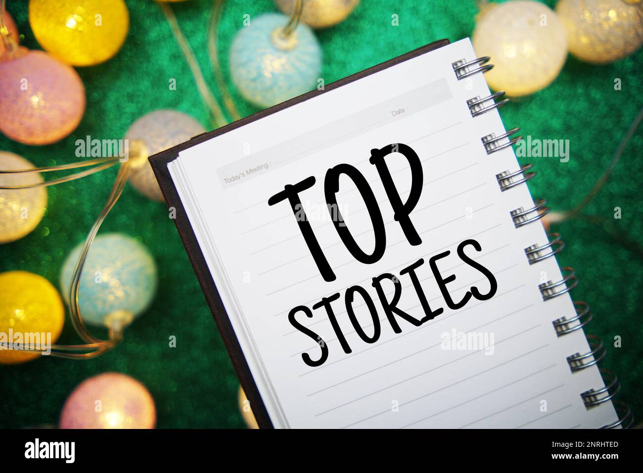 Top stories text message on notepad background Stock Photo - Alamy