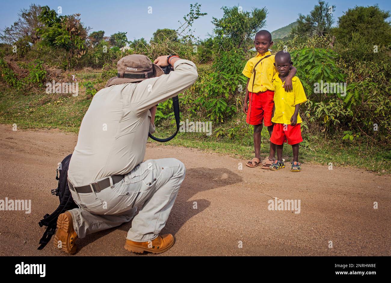 Photographer taking pictures of children, near the fishing village of ...