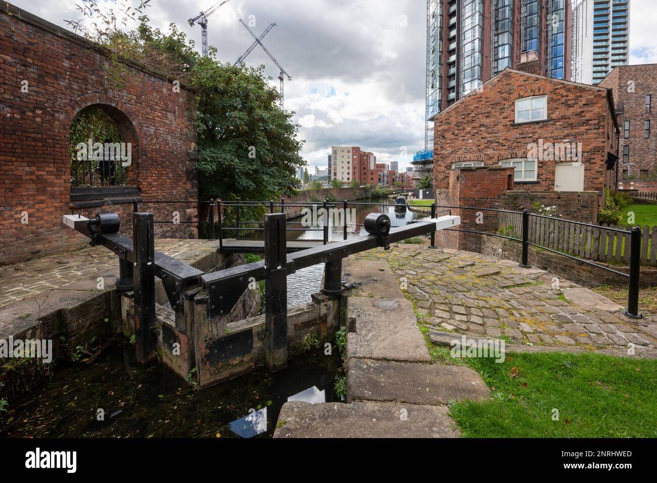 Lock on the Ashton Canal by the old lock keepers cottage at New ...