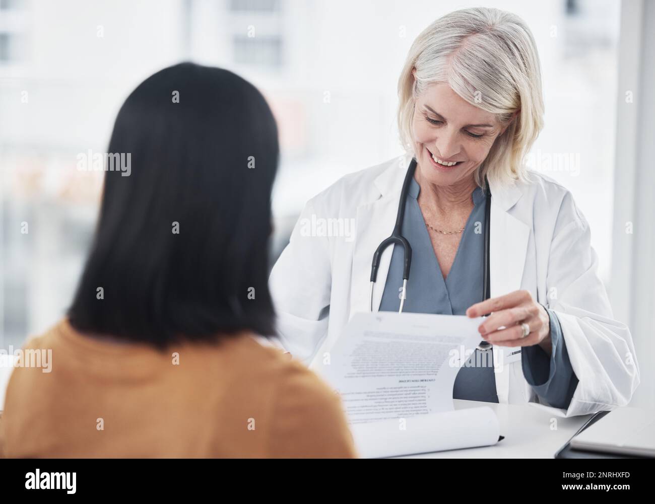 Well done on keeping up with your routine checkups. a doctor having a ...