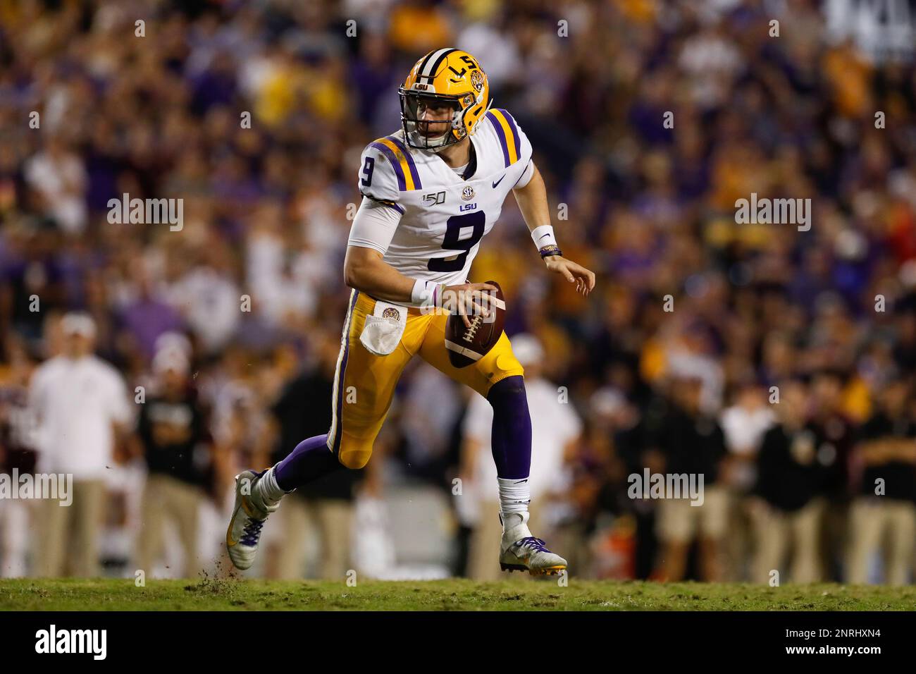 LSU quarterback Joe Burrow (9) rolls out to throw the ball during an ...