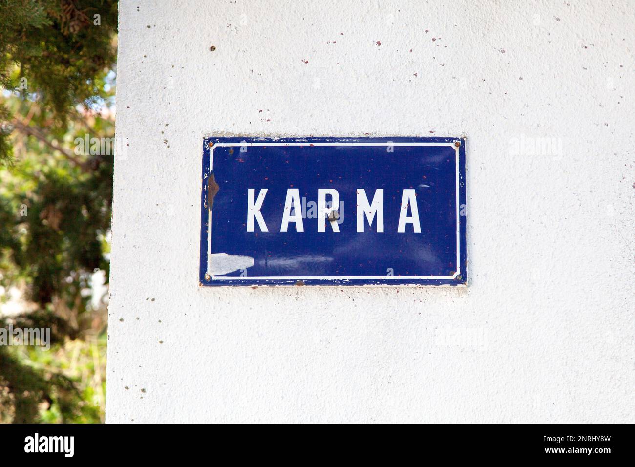 Blue street plate with the word "Karma" written in the middle Stock ...