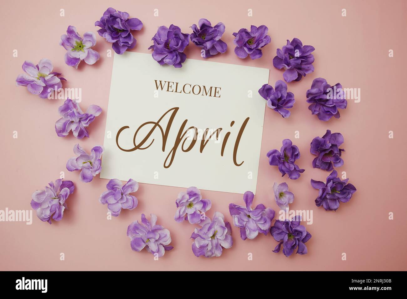 Welcome April card typography text with flower bouquet on pink ...