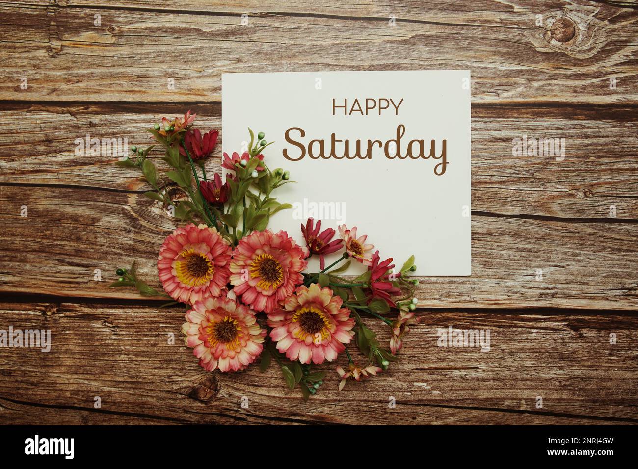 Happy Saturday typography text with flowers on wooden background Stock ...