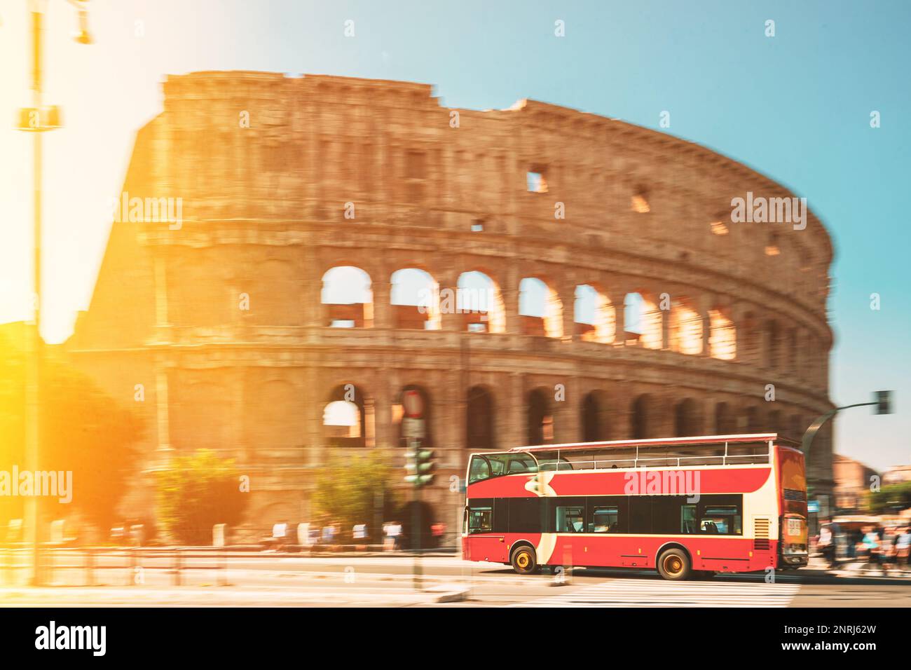 Rome, Italy. Colosseum. Glare Light On Red Hop On Hop Off Touristic Bus ...