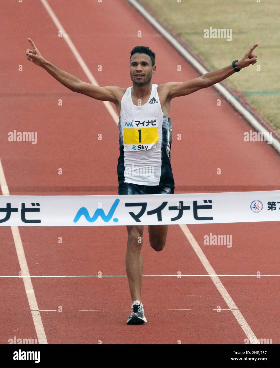 El Mahjoub Dazza of Morocco crosses the finish line during Fukuoka ...